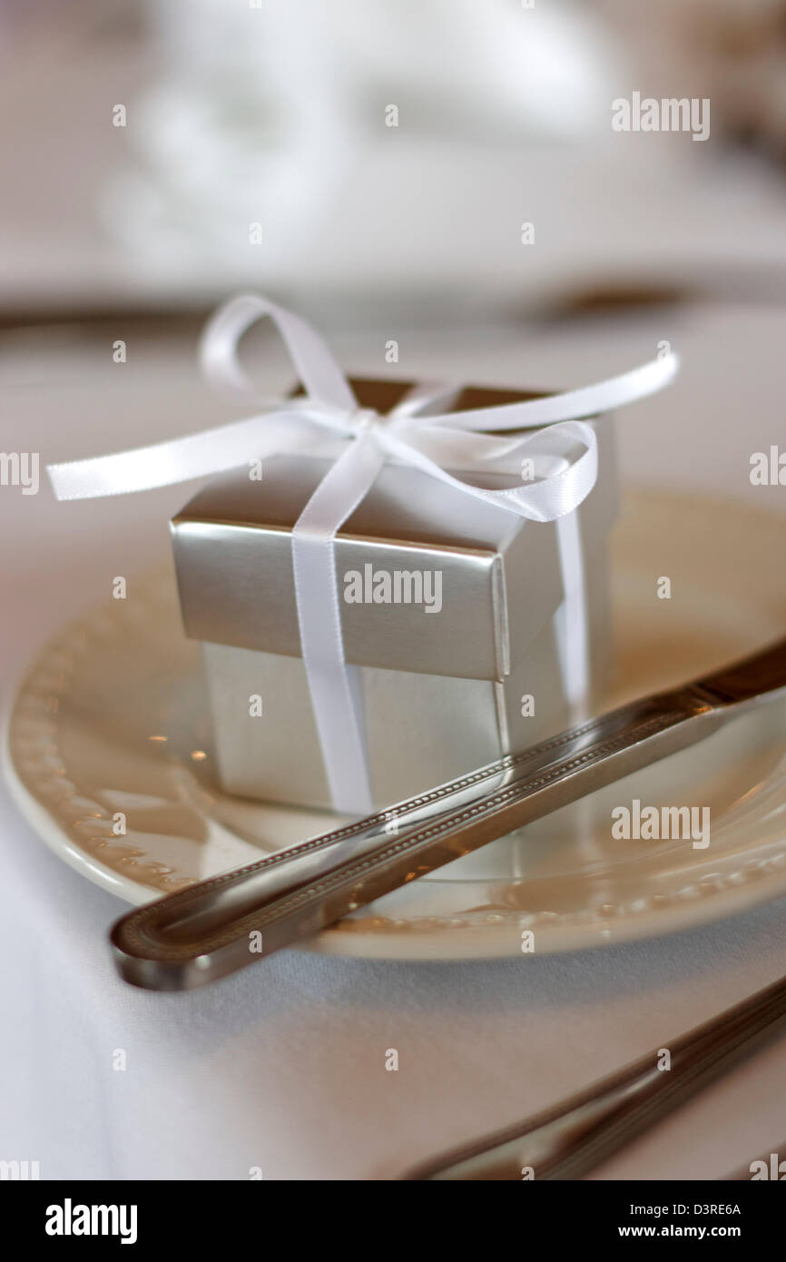 Table setting with silver gift-box Stock Photo - Alamy