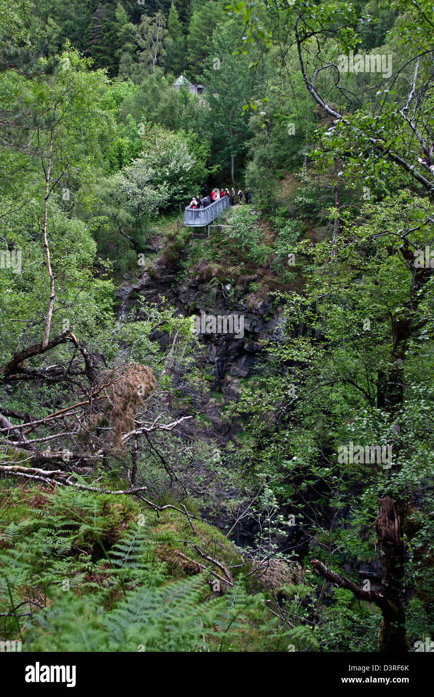 Visitors on a platform view the natural wonder of Corrieshalloch Gorge ...