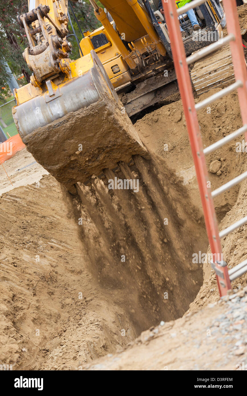 Working Excavator Tractor Digging A Trench Stock Photo - Alamy