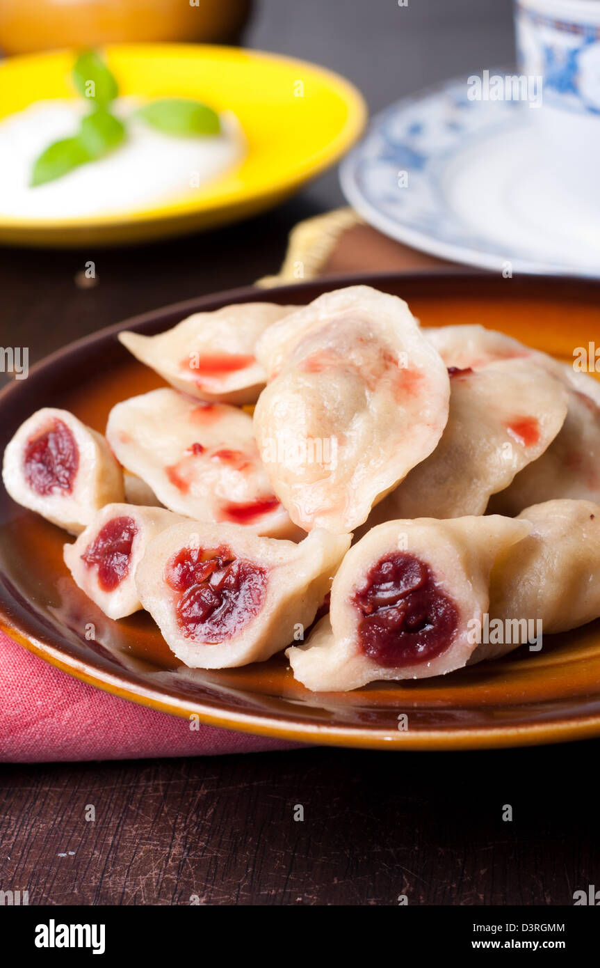 Traditional home handmade dumplings with morello cherries - country of ...