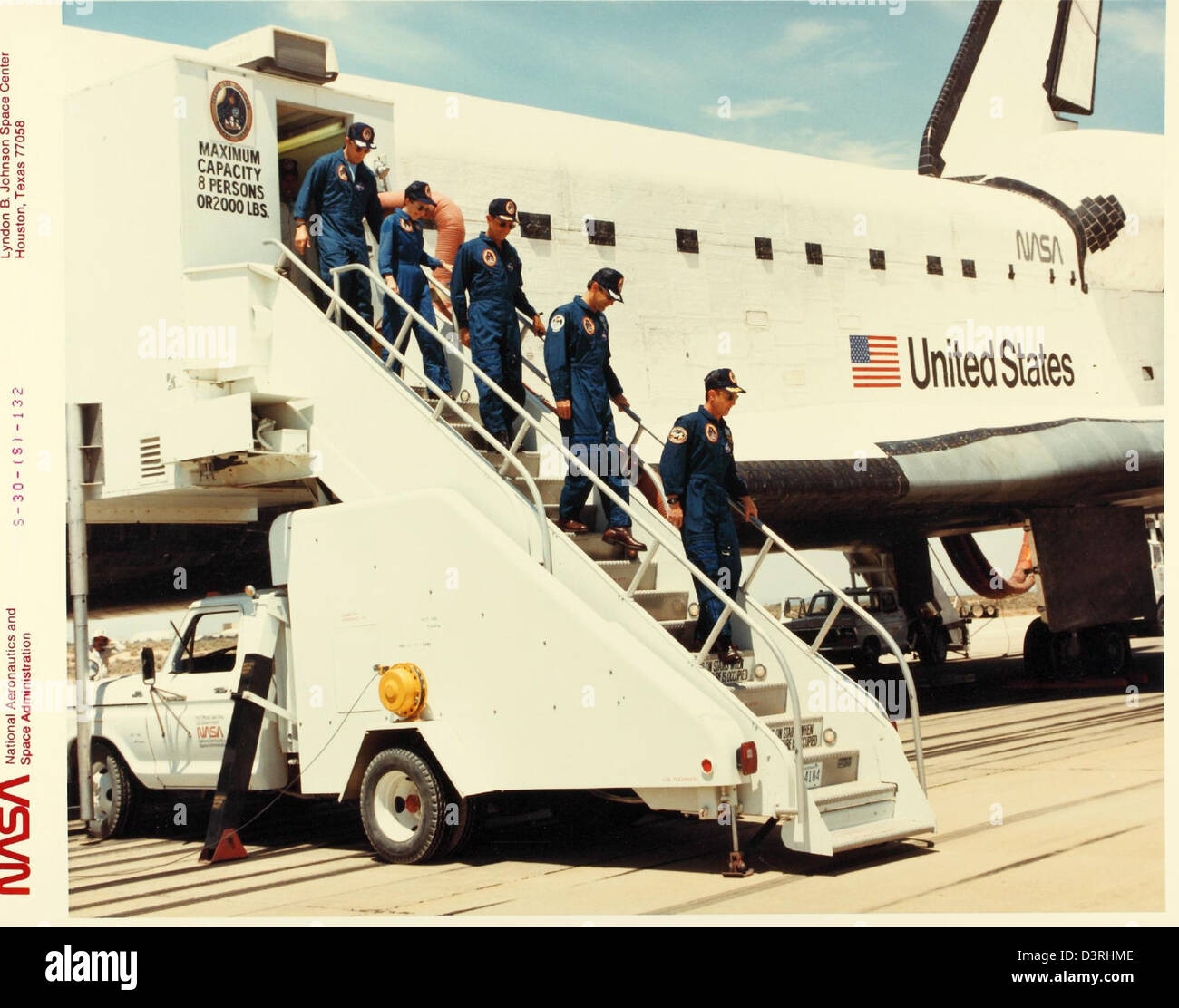 A glossy photo commemorates the Space Shuttle Program, which operated ...