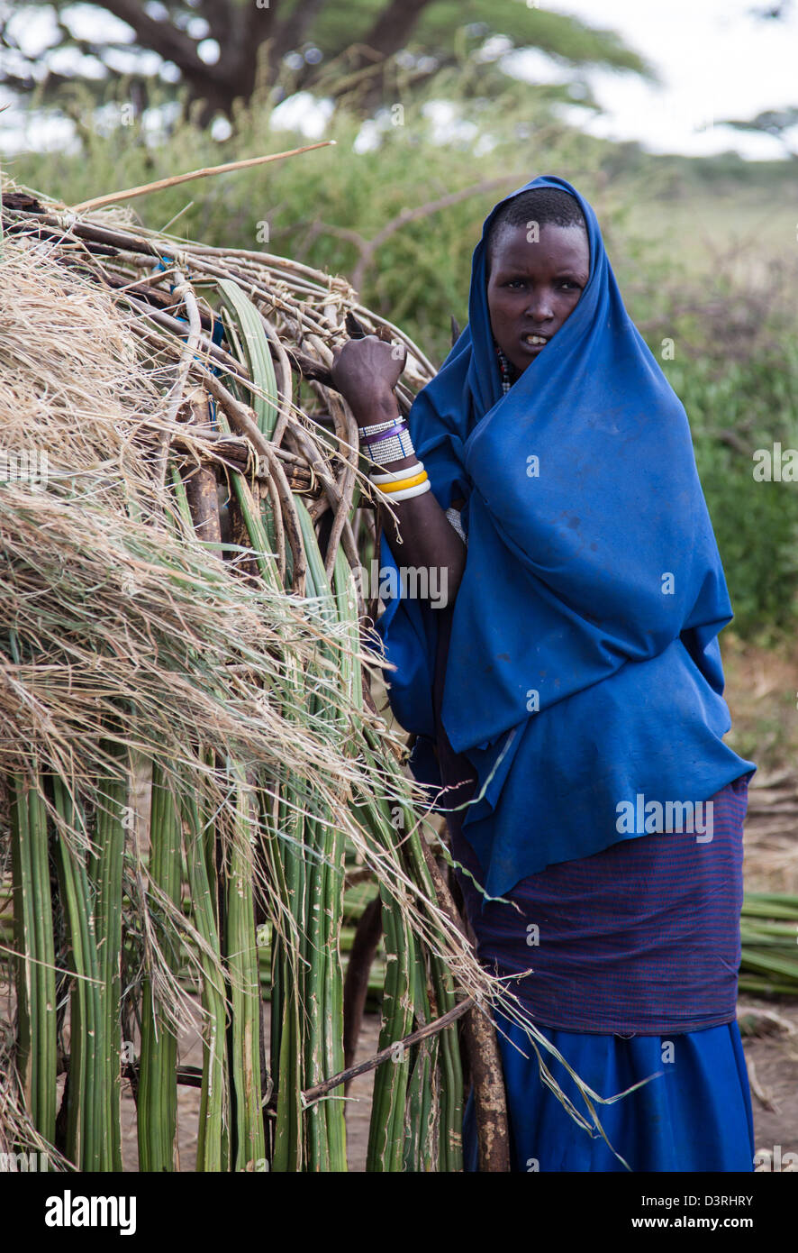 A masai girl looks bashfully ino the camera. Serengeti National Park ...