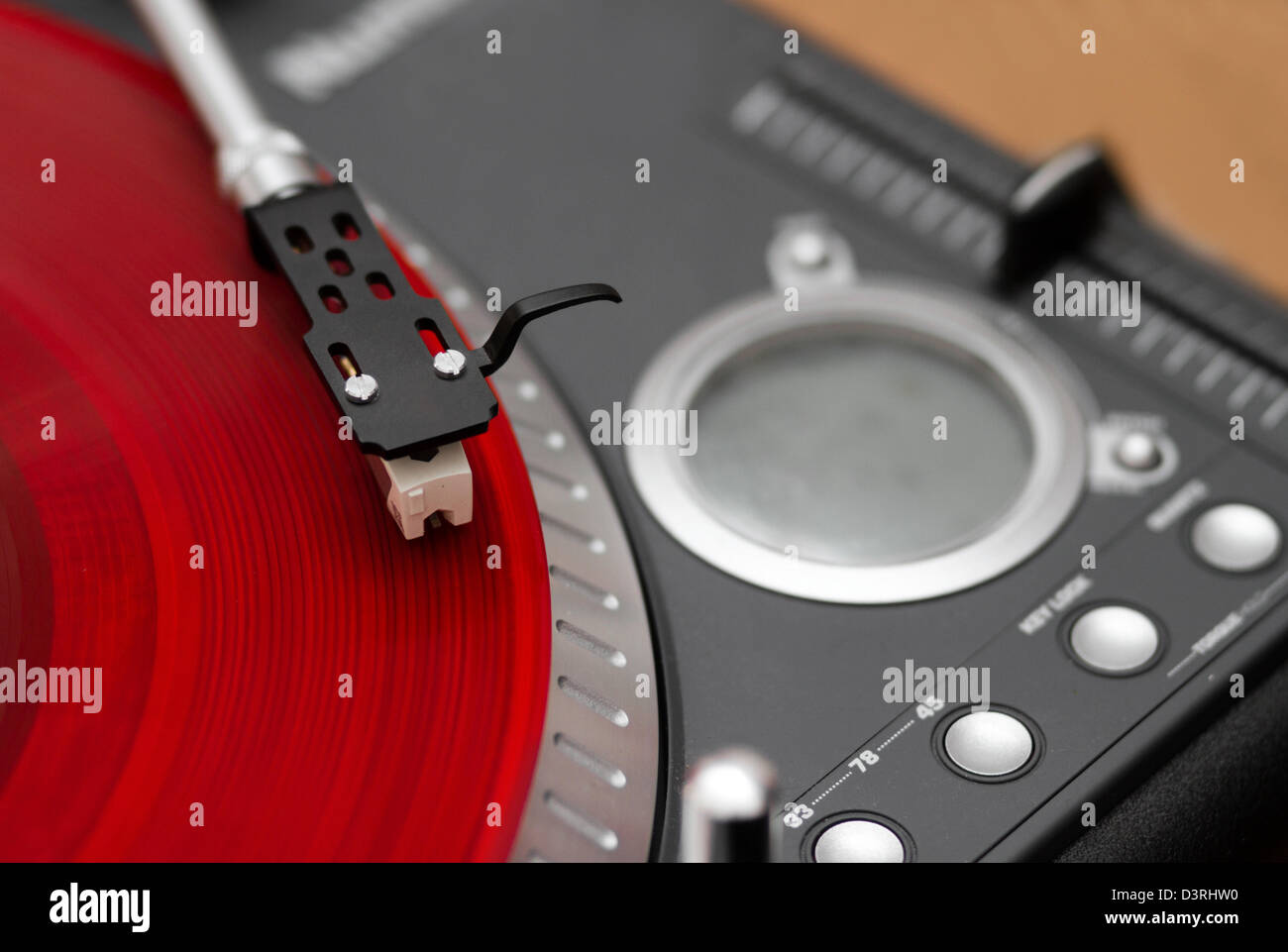 Turntable ripping red vinyl record with music Stock Photo - Alamy