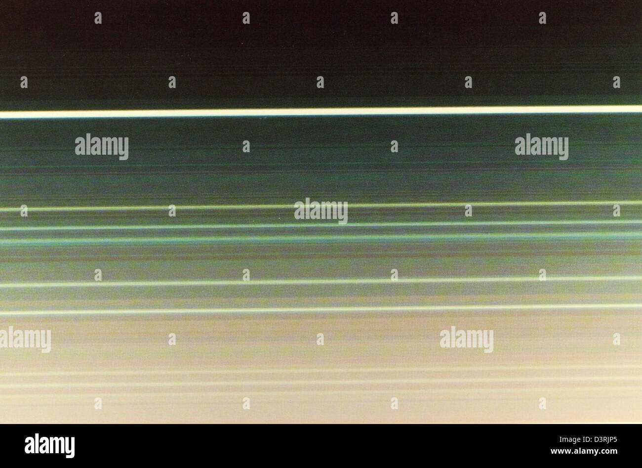 A glossy photo of NASA’s Voyager spacecraft, launched to explore the outer reaches of the solar ...