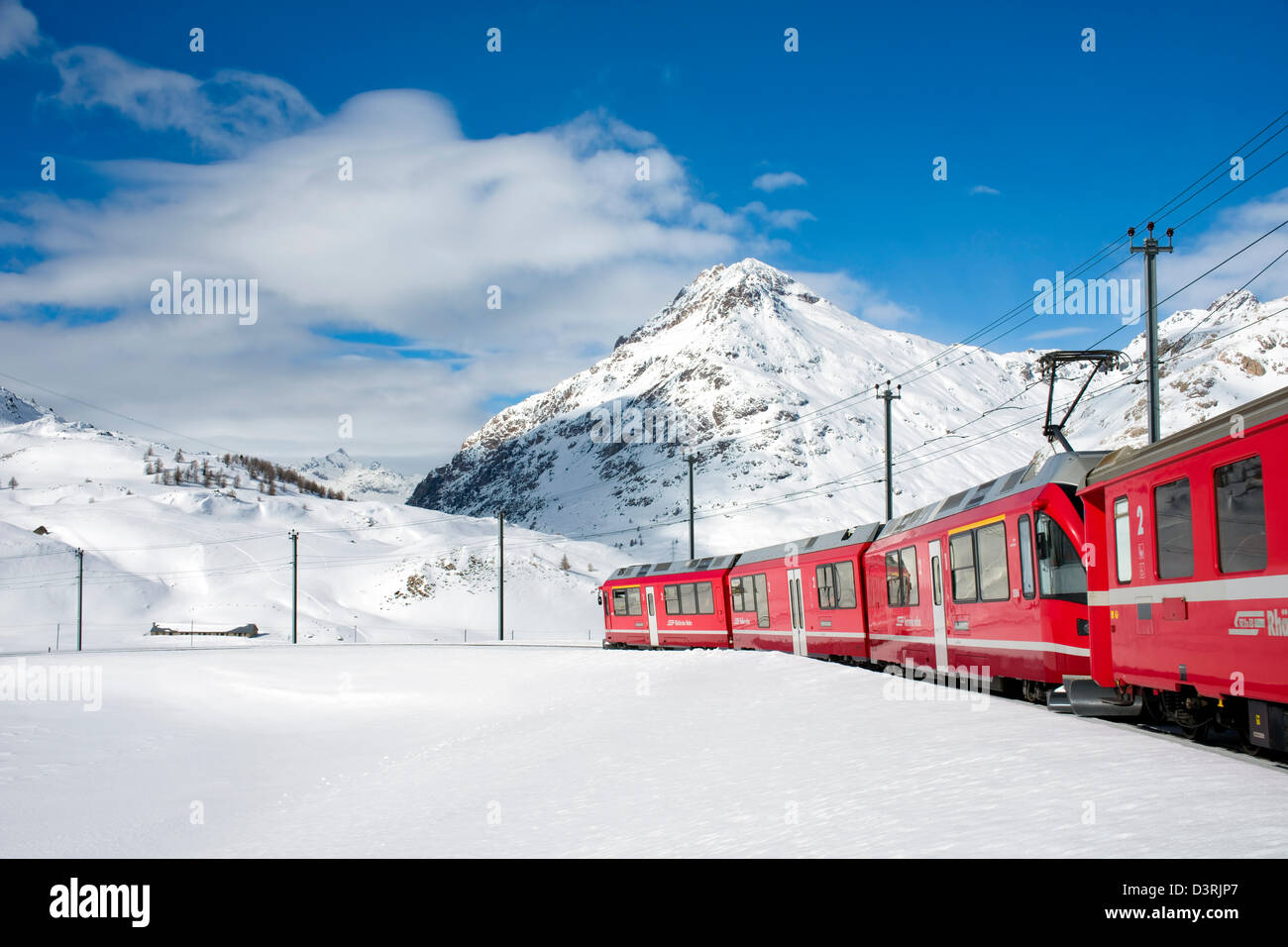 Mountain train at Lago Bianco Bernina Pass in Winter, Grisons ...