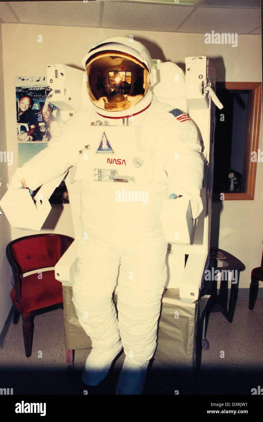 A glossy photo of a NASA space suit, designed for astronauts to wear ...