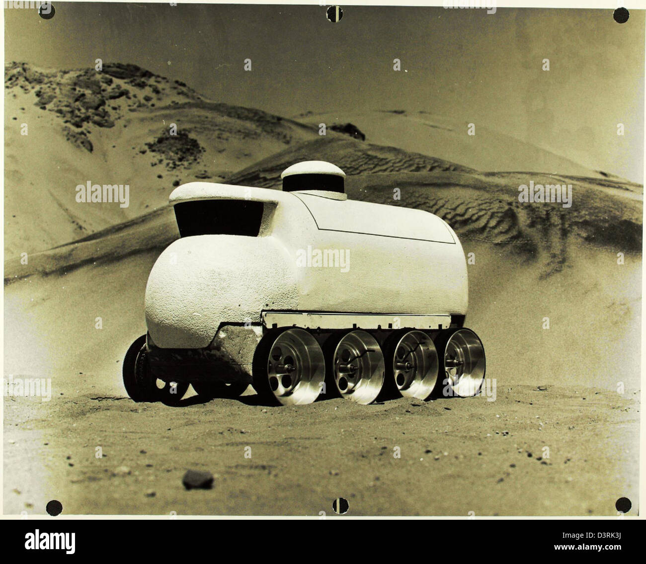 A glossy photo of models of the Lunar Roving Vehicle (LRV) showcases ...
