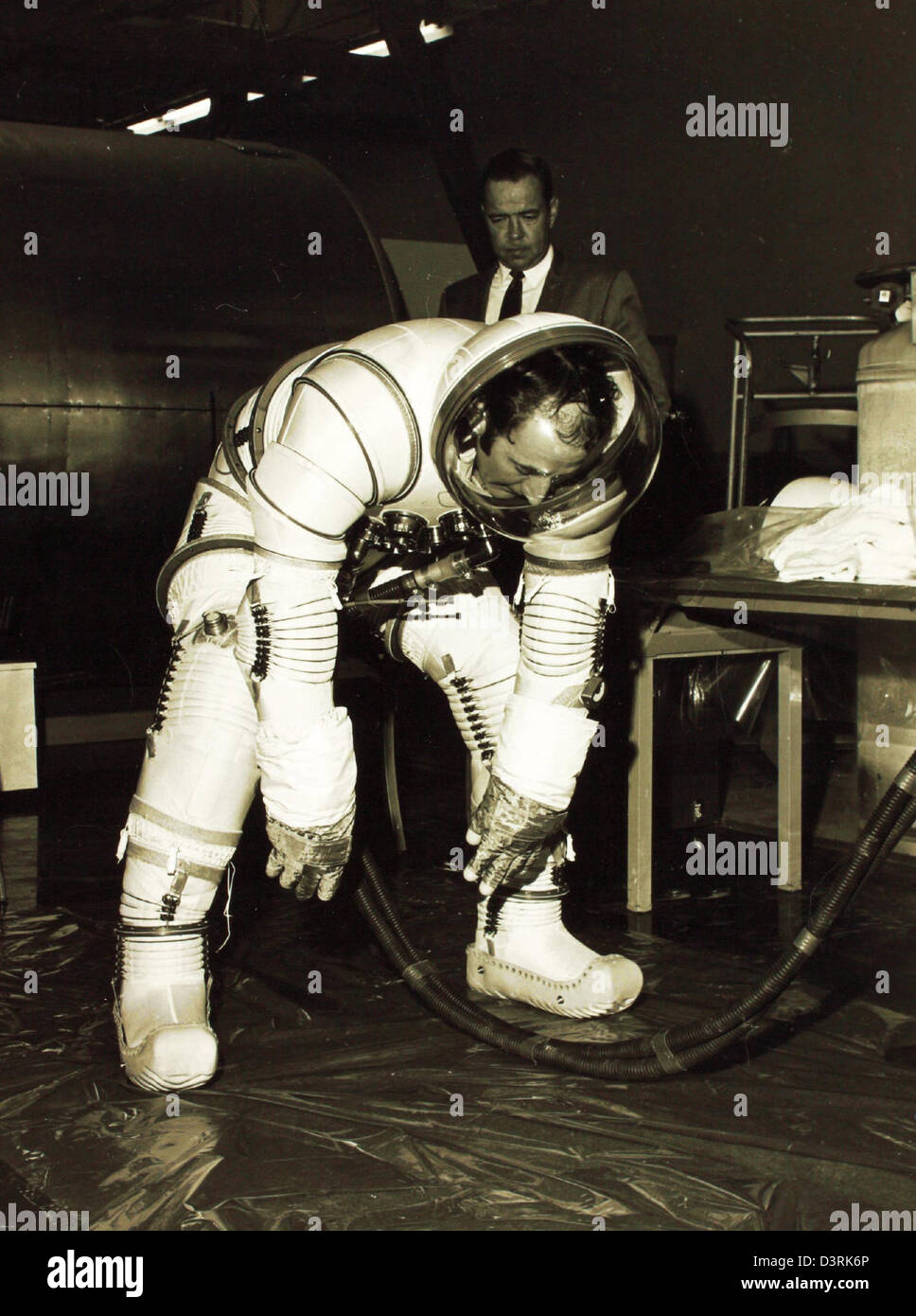 A glossy photo showcasing various space suits used by astronauts during ...