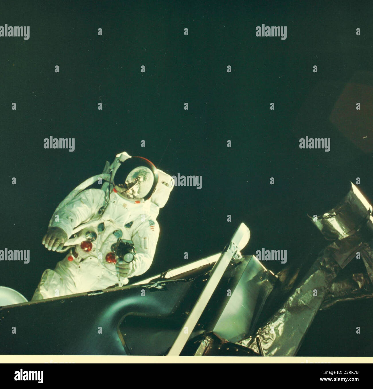 A detailed photograph of a NASA space suit, showcasing its life-support ...