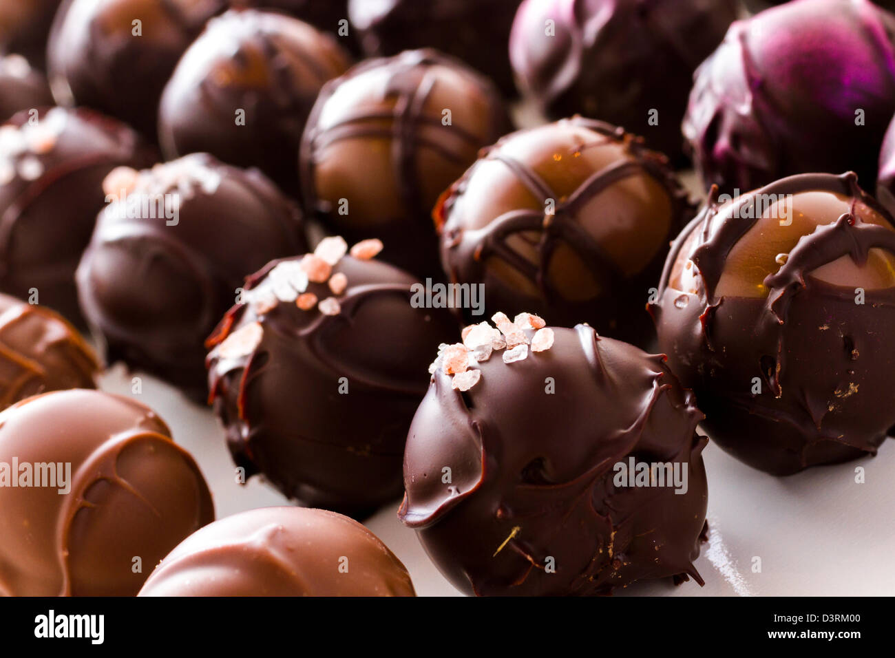 Gourmet assorted truffles hand made by chocolatier Stock Photo - Alamy