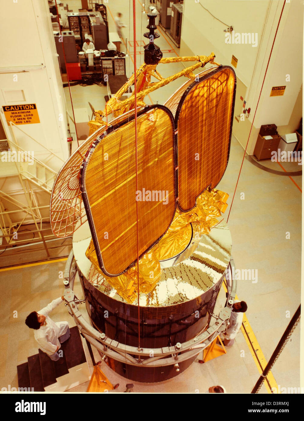 A glossy photograph of the COMSTAR satellite, which has provided ...