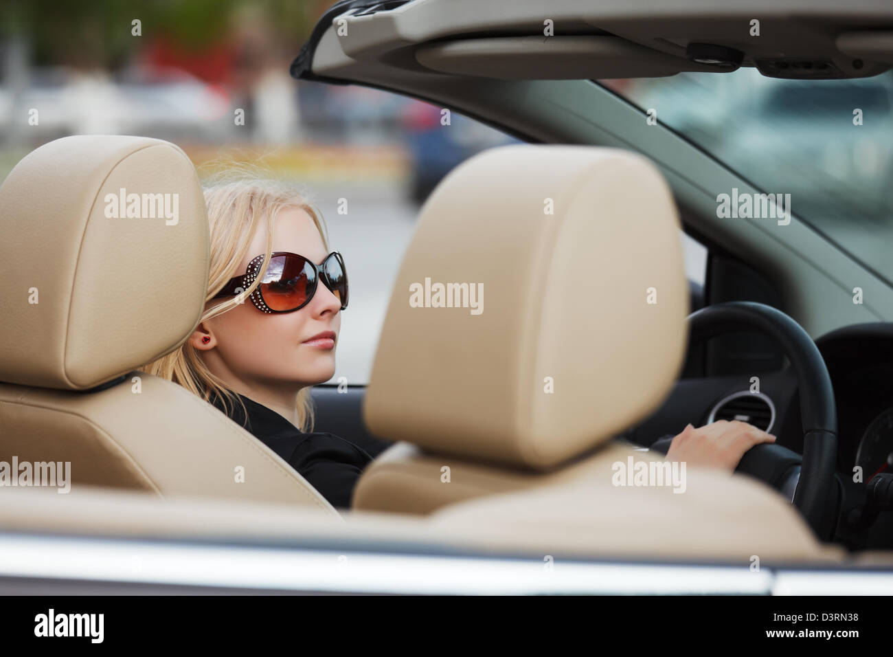 Young woman in a convertible car Stock Photo - Alamy
