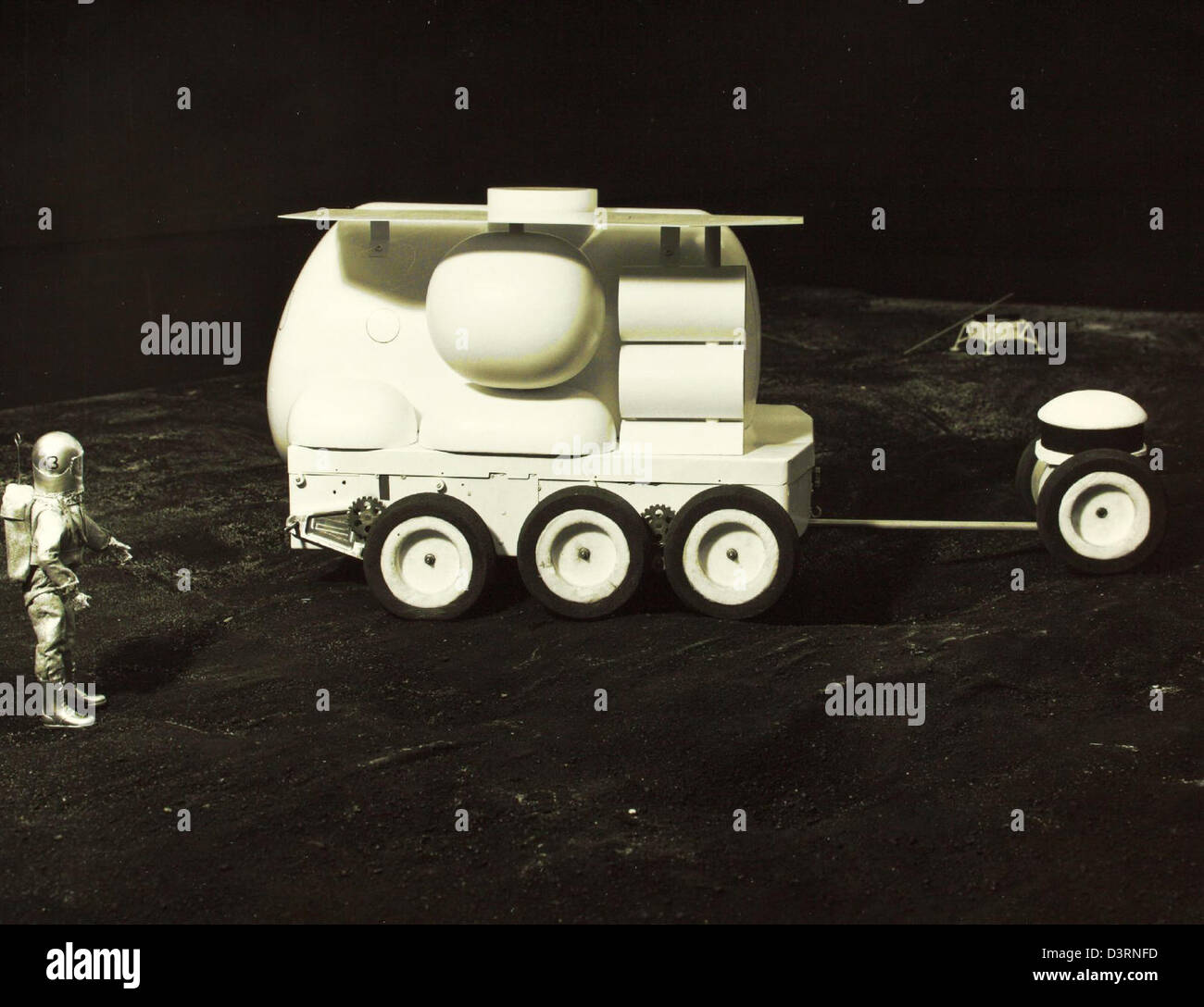 A glossy photo of models of the Lunar Roving Vehicle, a key tool used ...