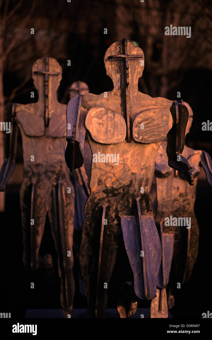 Metal runner Sculptures sunset Stock Photo - Alamy