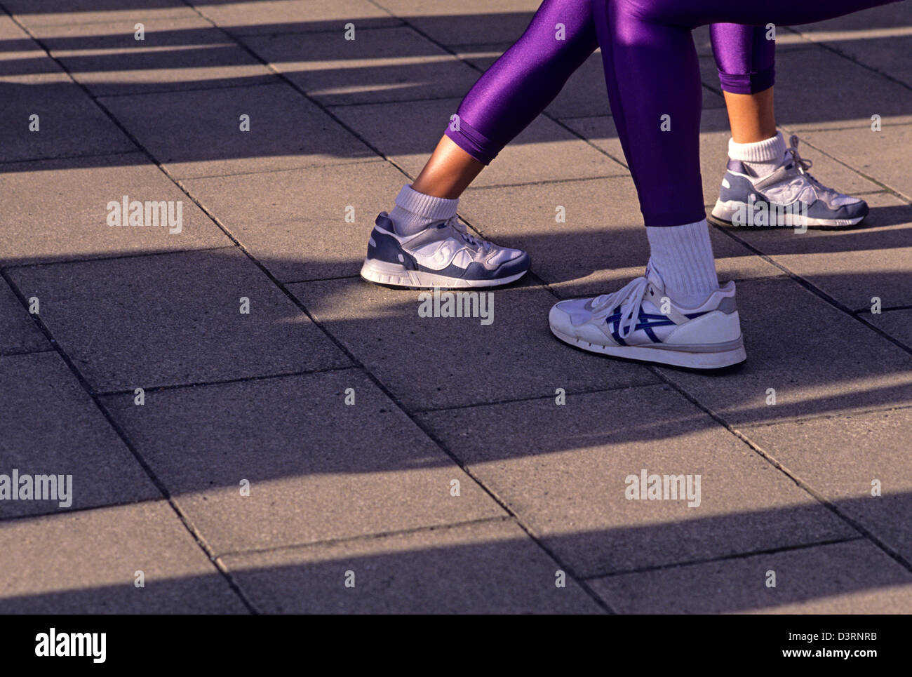 Humor with runners warming up before run Stock Photo - Alamy