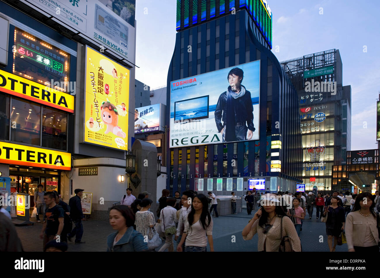 Advertising signs covering buildings along Ebisubashi-suji Avenue in ...