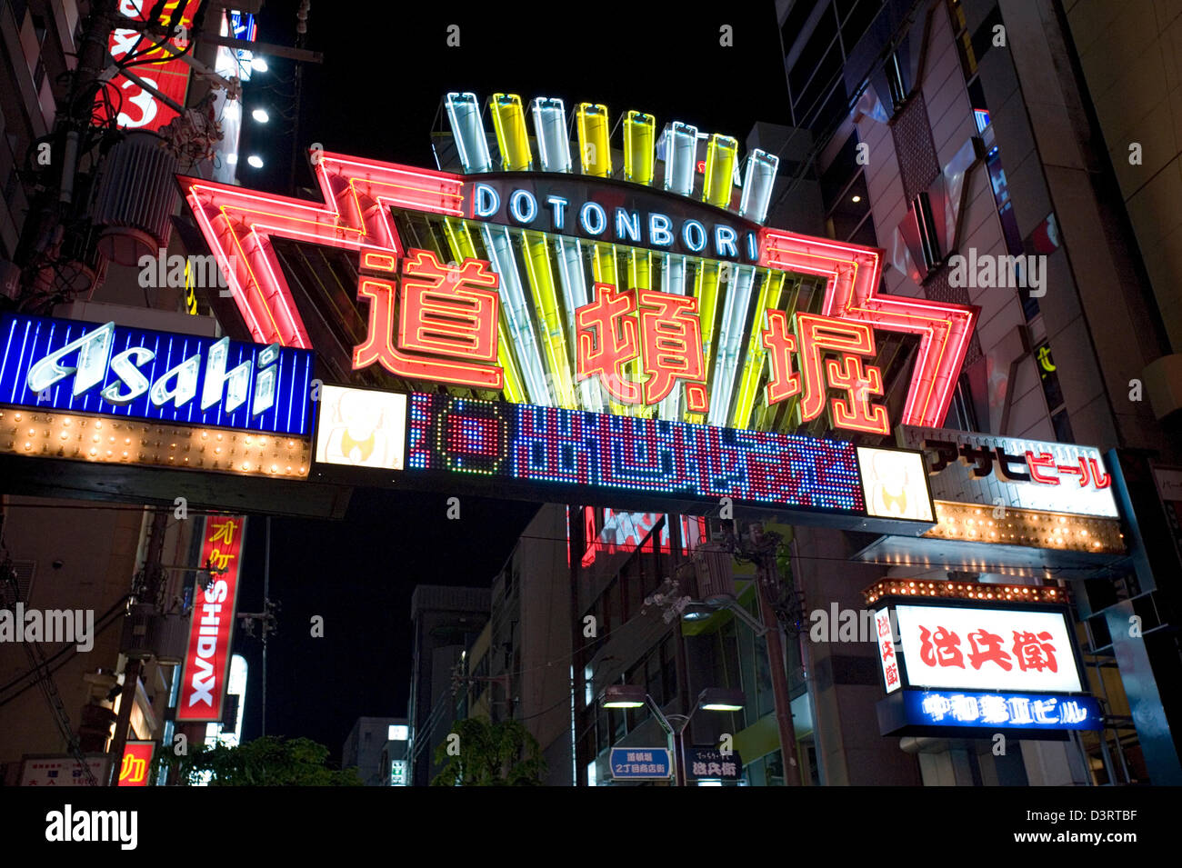 Neon sign announces the entry to the Dotonbori Street restaurant and ...