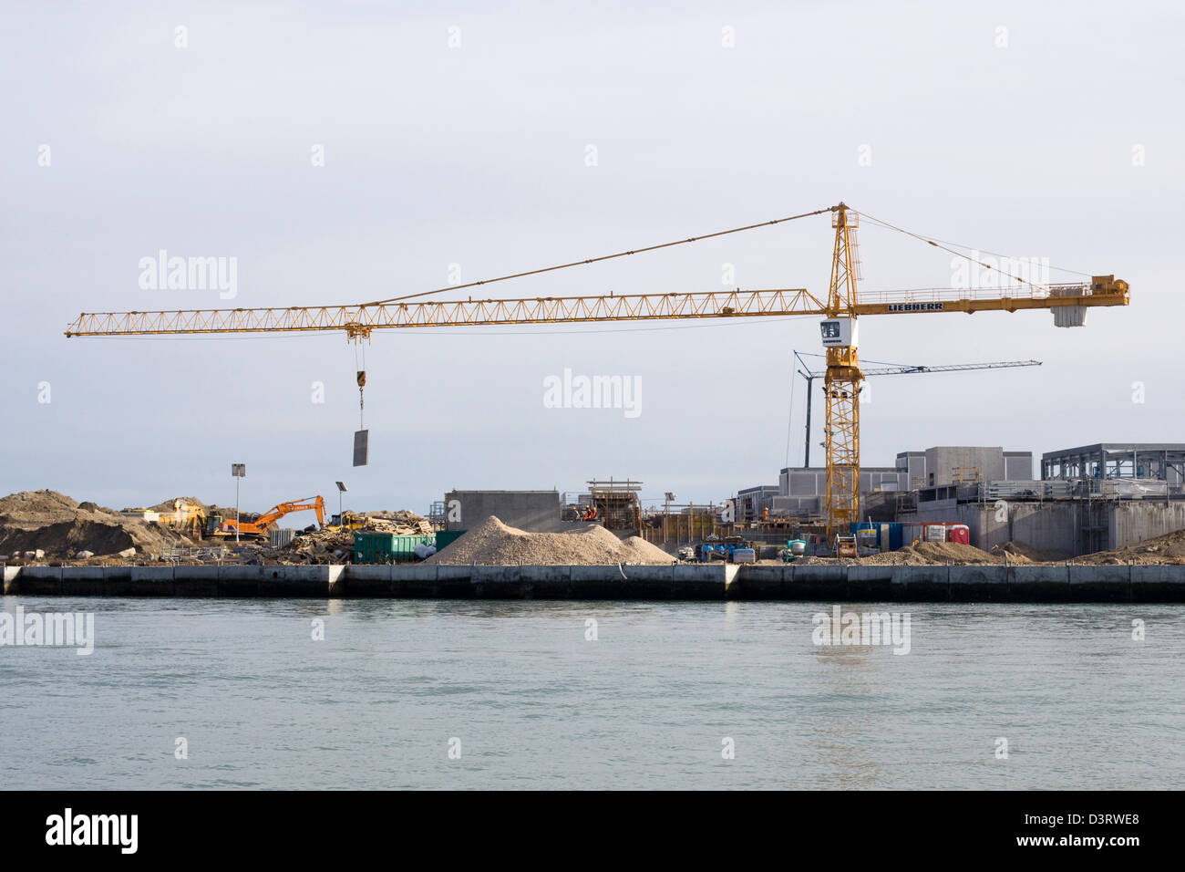 Construction cranes move building materials hi-res stock photography ...