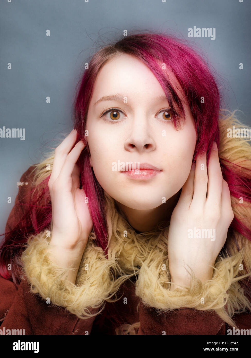 Emo look girl with red hair on gray background Stock Photo - Alamy
