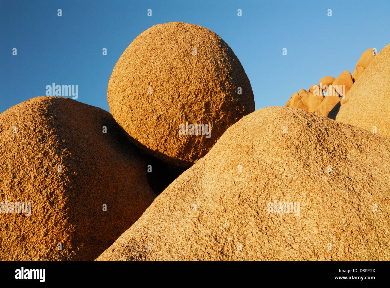 balancing granite boulders in the evening sun Stock Photo - Alamy