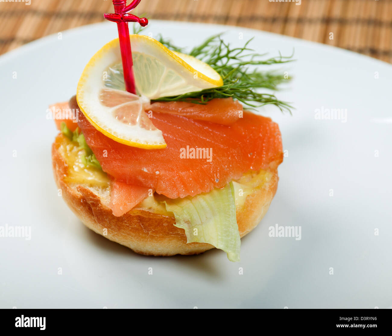 Canapes with Smoked Salmon and lemon Stock Photo - Alamy