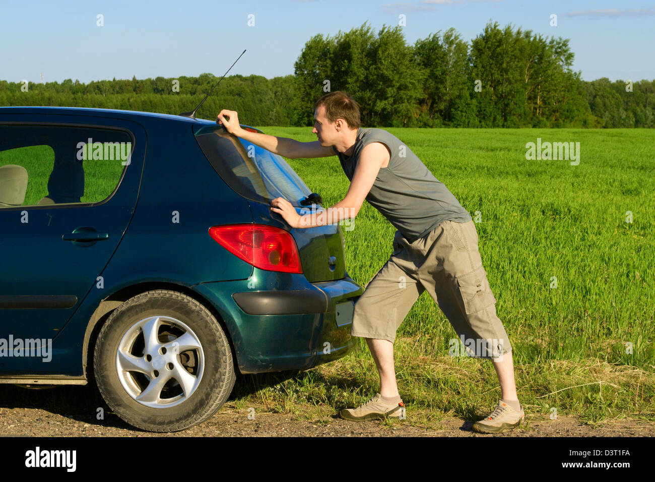 Men Pushing Broken Down Car High Resolution Stock Photography and ...