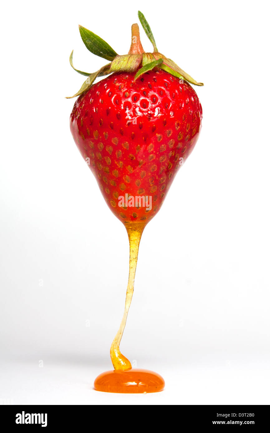 Fresh ripe strawberry dripping with a rich sweet honey based syrup ...
