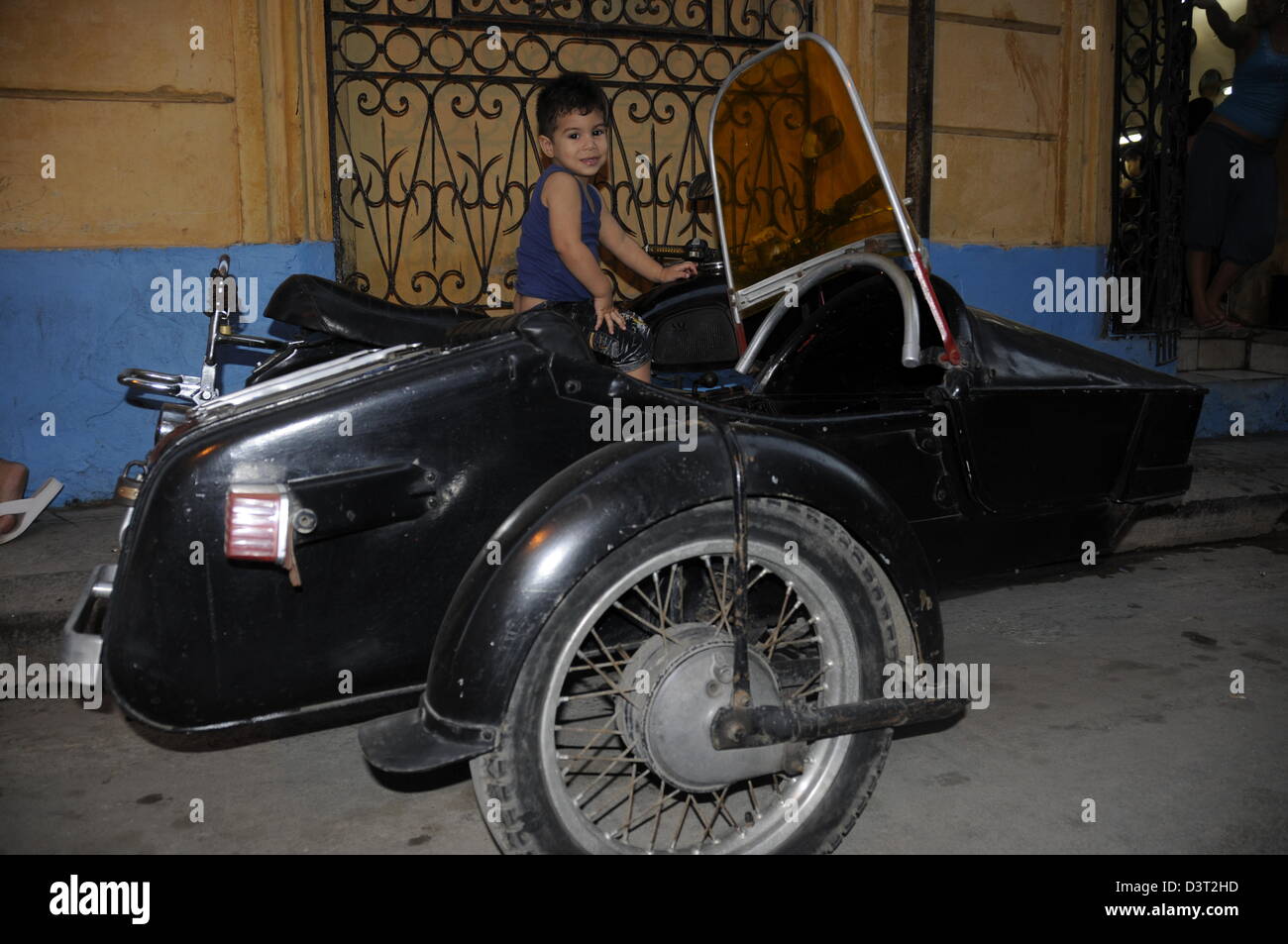 Boy in motorcycle sidecar, old town Havana, Cuba Stock Photo - Alamy