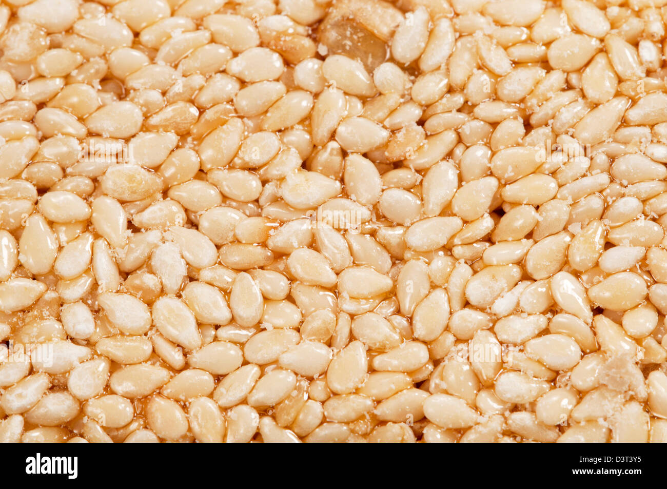 Sesame brittle as a background, macro shot Stock Photo - Alamy
