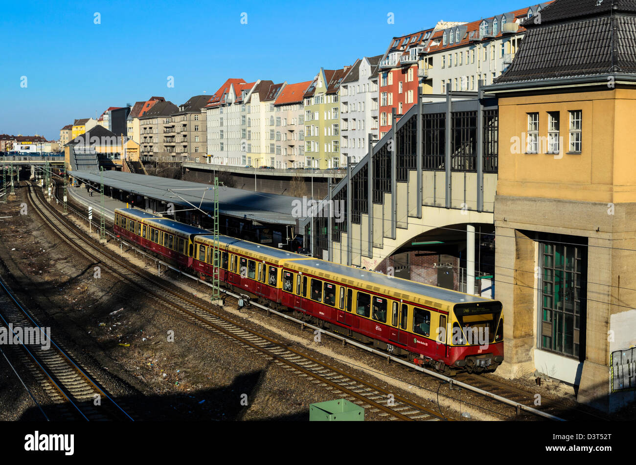 Commuter train leaving station Stock Photo - Alamy