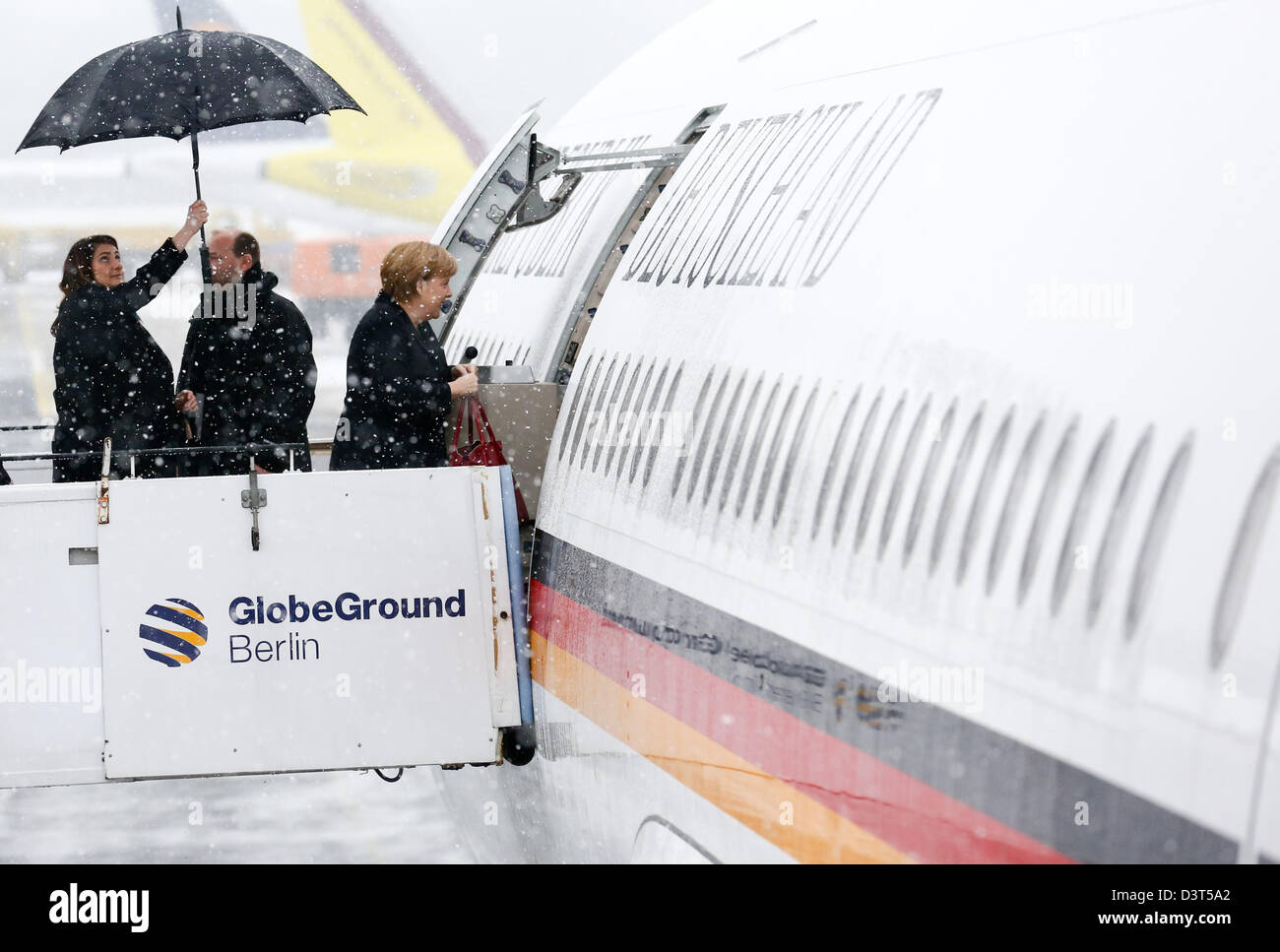 German Chancellor Angela Merkel enters a German Air Force Airbus A340 ...