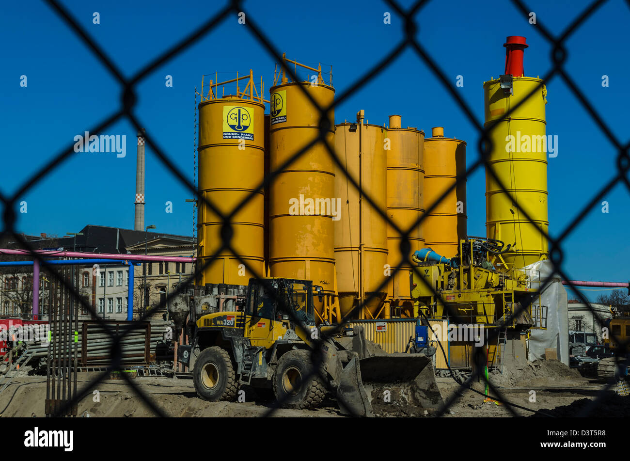 Yellow containers at road construction site Stock Photo - Alamy