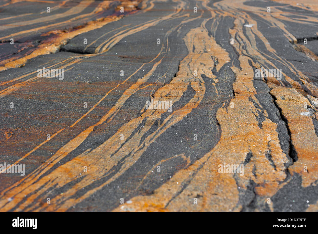 Different patterns of yellow streaks in lava rock Stock Photo - Alamy