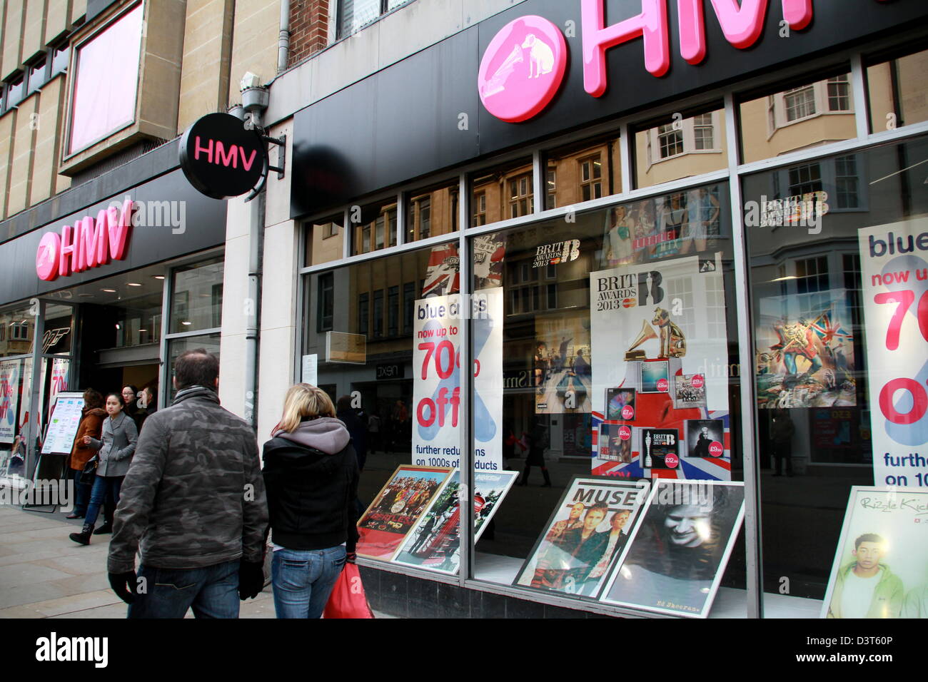 Shopper walk passed HMV store in Oxford, England February, 2013 Stock ...