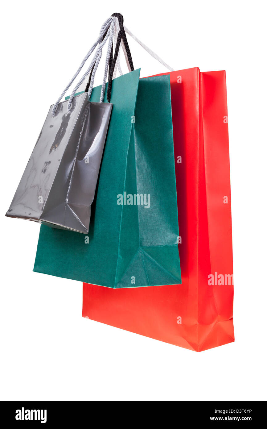 three paper shopping bags isolated on white backgrounds Stock Photo - Alamy