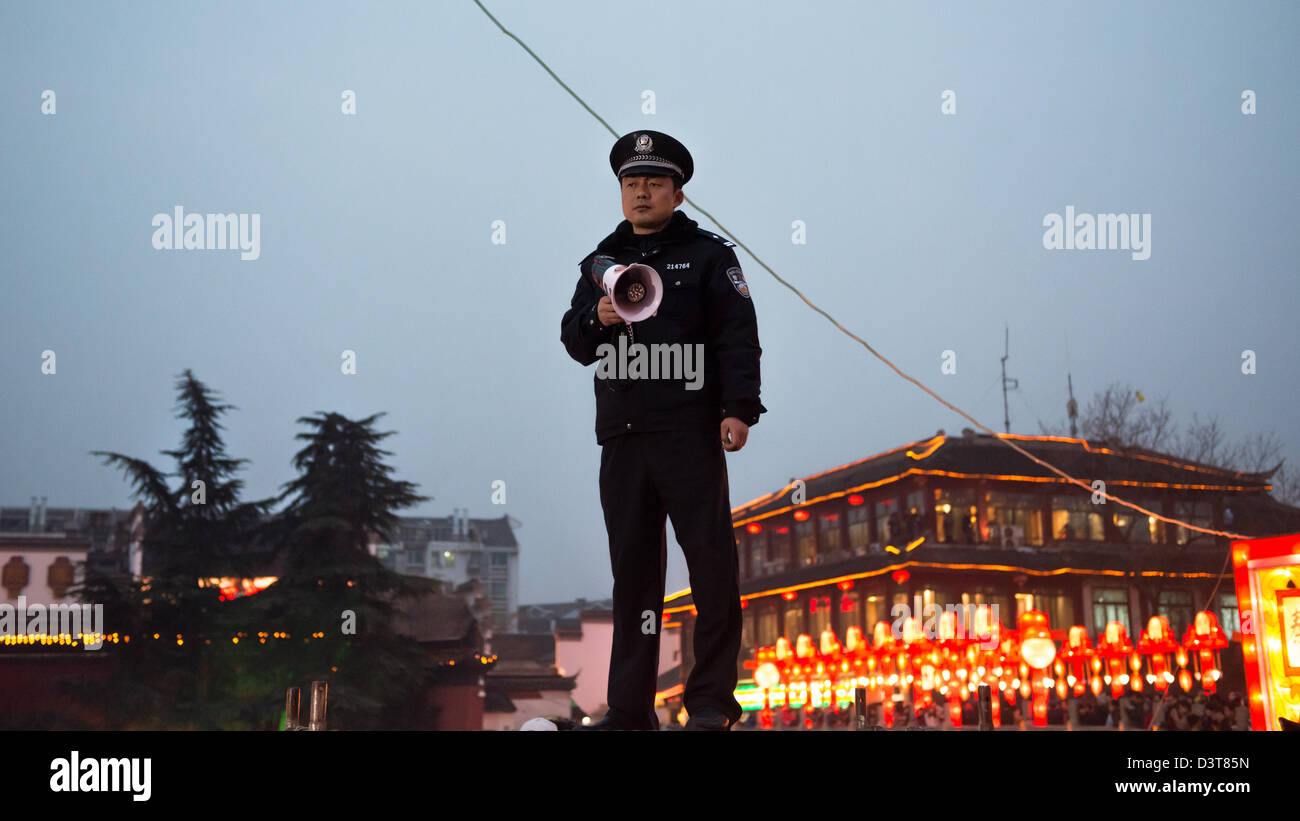 Nanjing, China. 24th Feb, 2013. Police overlooking the crowd at the ...
