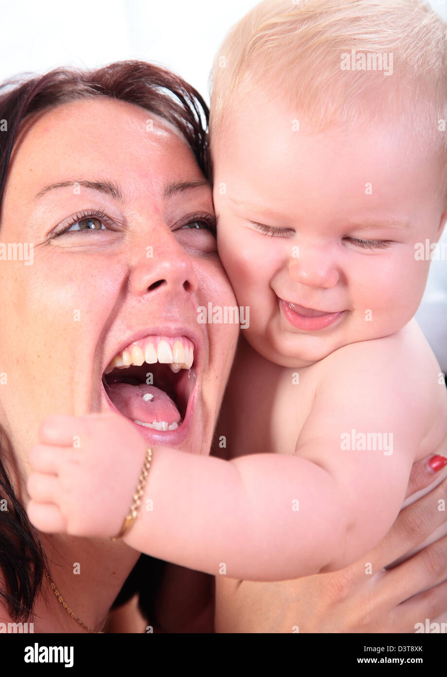 Mother and baby laughing Stock Photo - Alamy