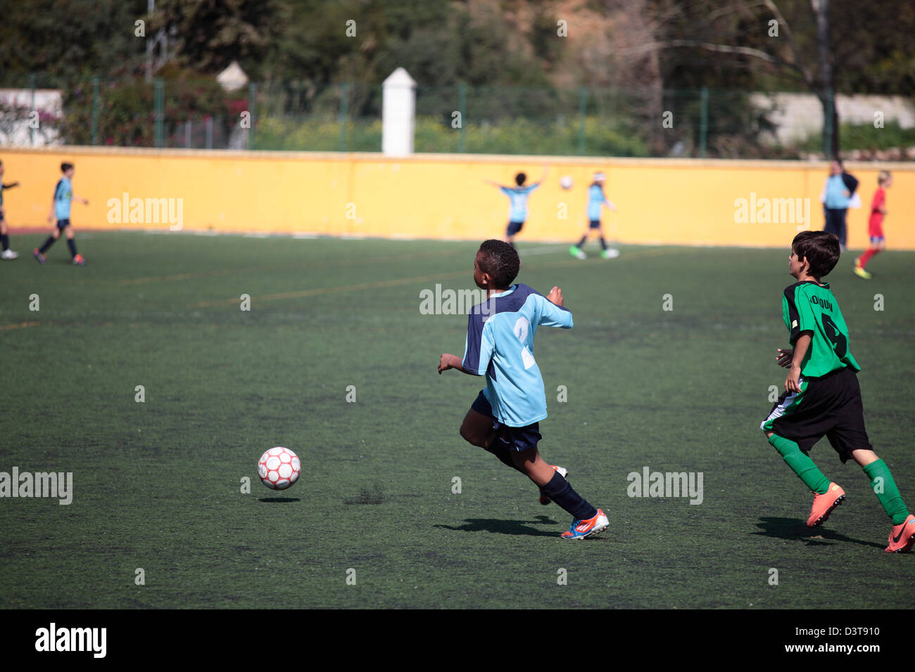 Black kid playing soccer hi-res stock photography and images - Alamy