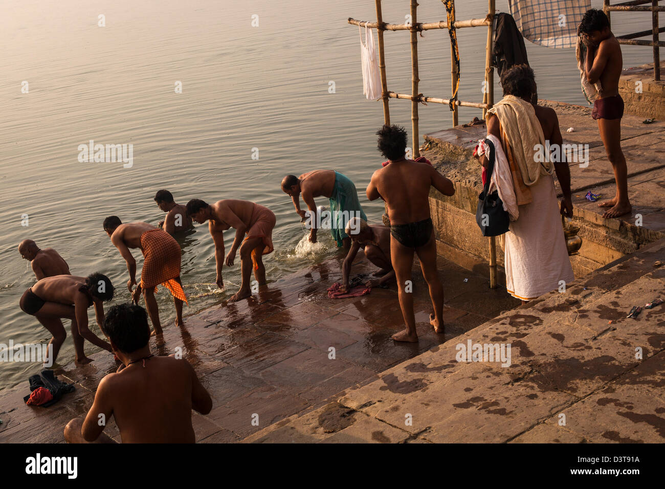 Indian men bathing in ganges hi-res stock photography and images - Alamy