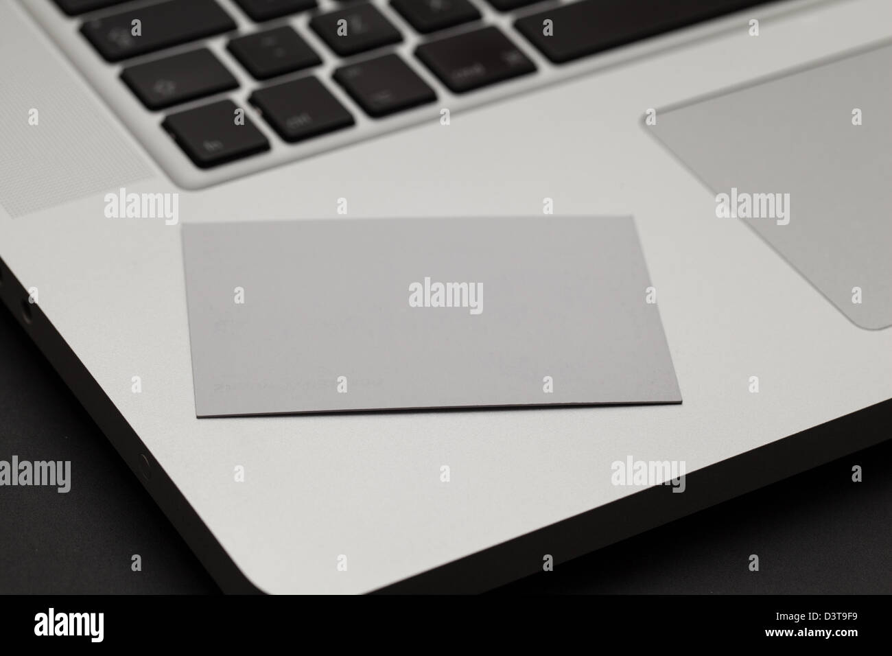 Business card on a notebook Stock Photo - Alamy