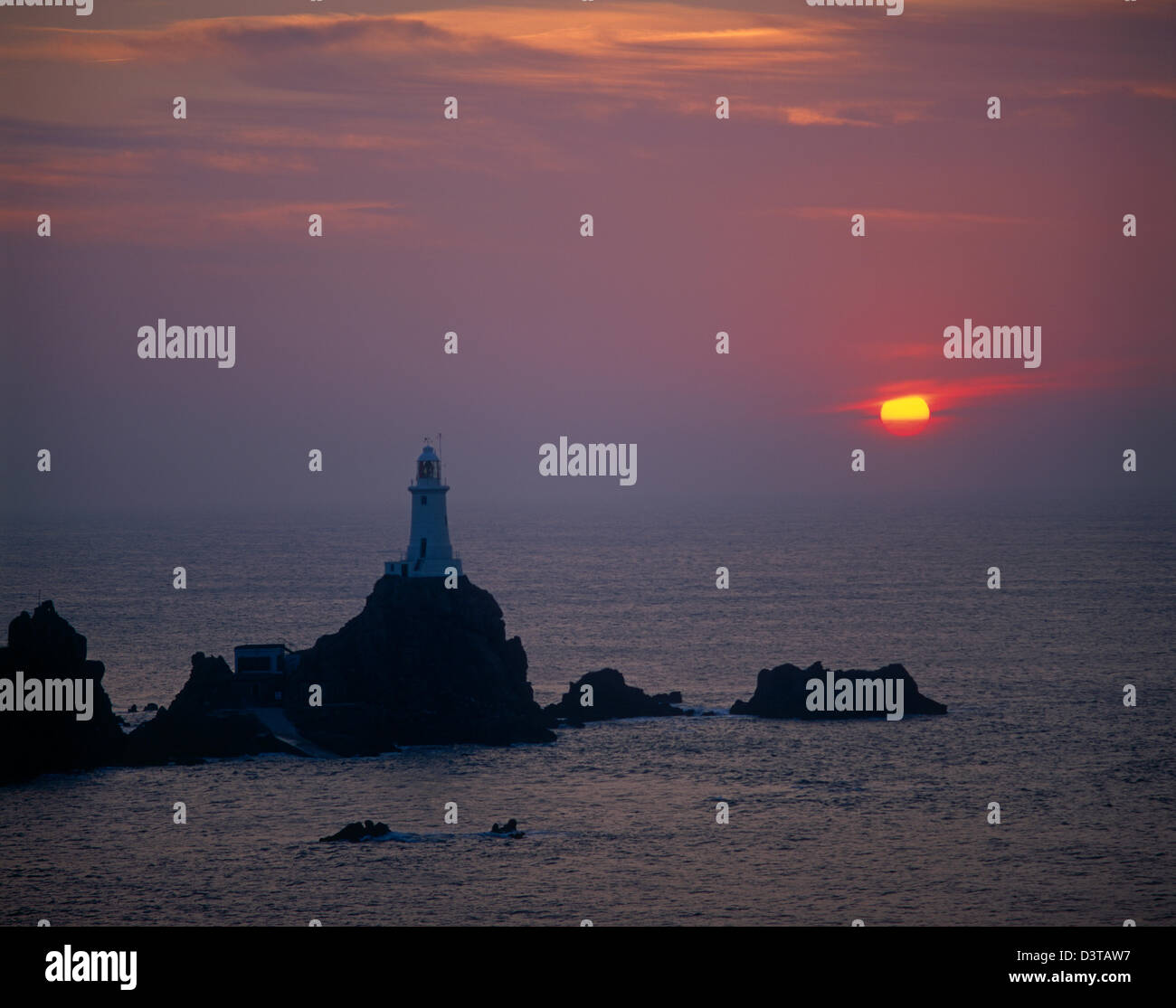 La Corbiere lighthouse at sunset, Jersey, Channel Islands Stock Photo ...