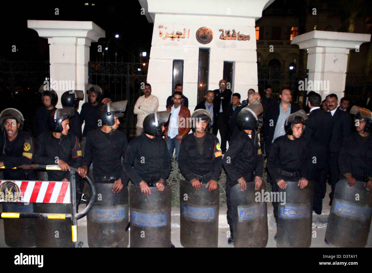 Cairo, Egypt. 24th Feb, 2013. Egyptian security forces stand guard as ...