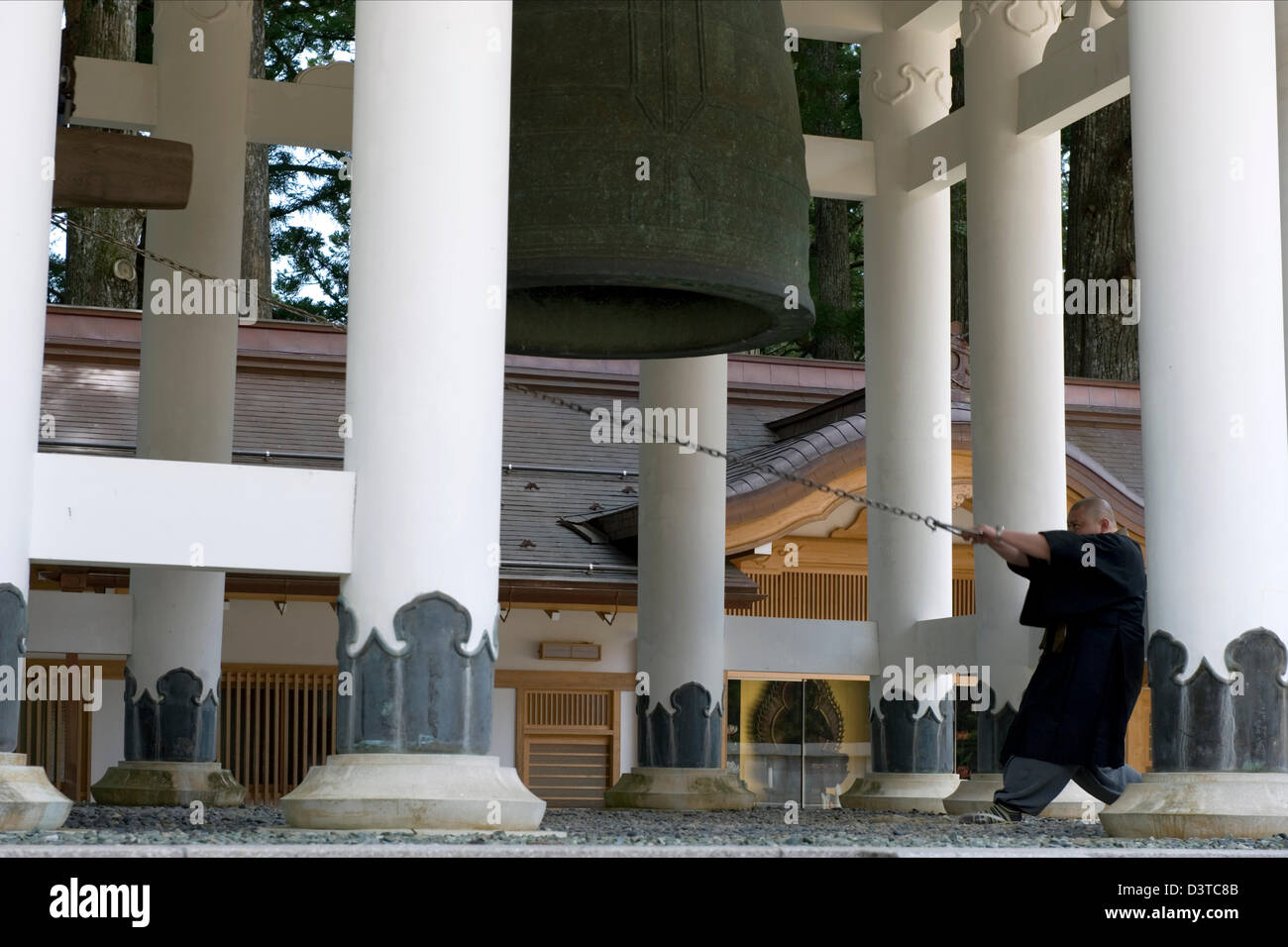 Buddhist monk ringing giant bell in Dai Garan at Kongobuji (Temple of ...