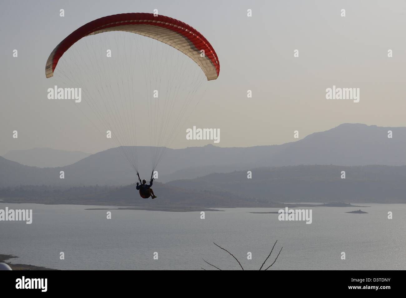 Paragliding over the lake Stock Photo - Alamy