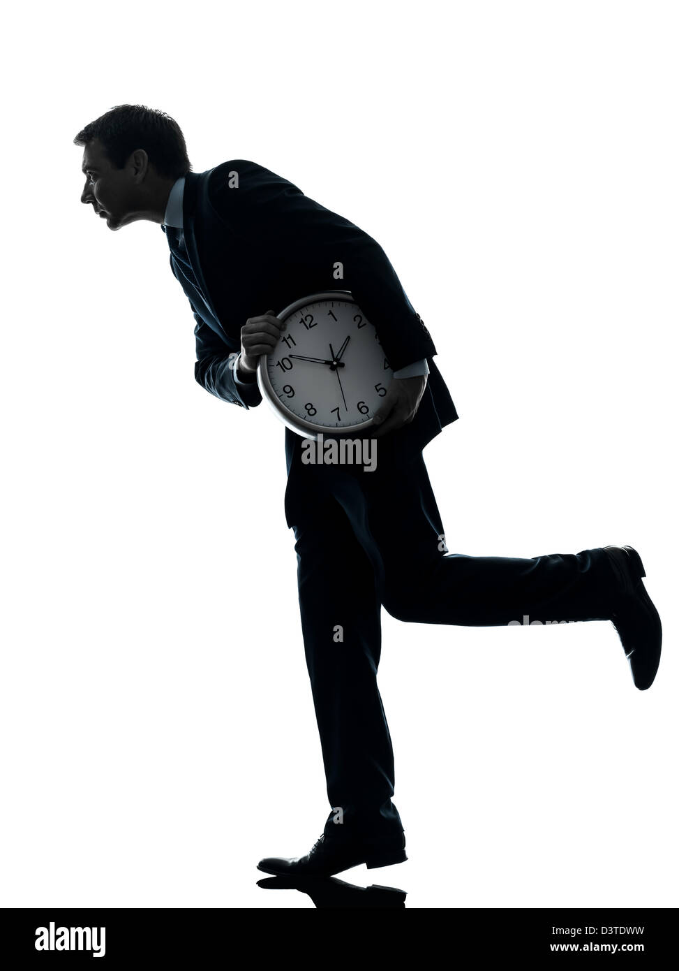 one businessman holding clock robbing time in silhouette studio ...