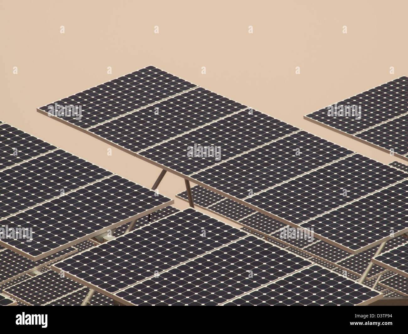 A series of large solar panels forms a symmetrical line at a power ...
