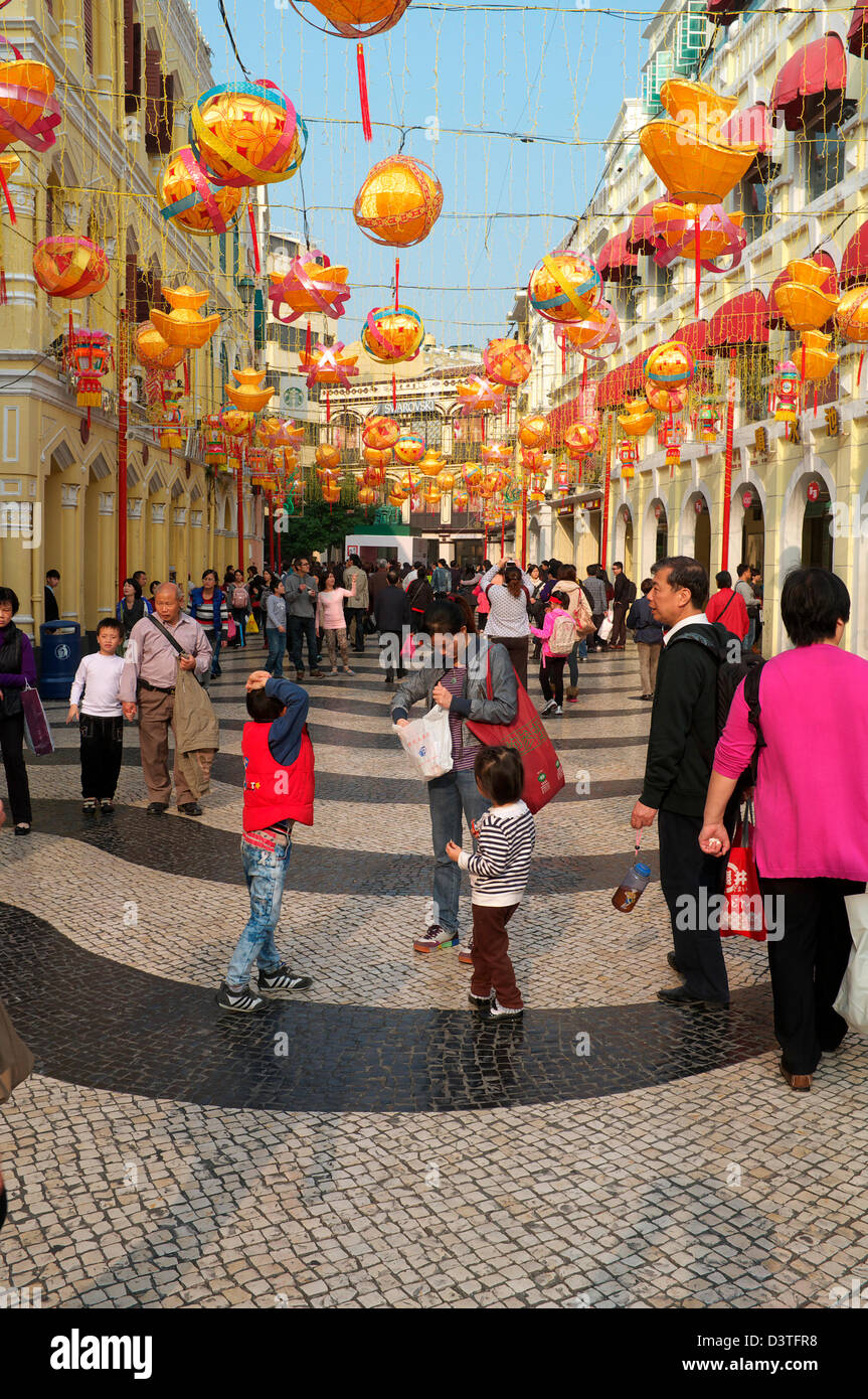 Crowds in Macau Senate Square which is decorated for Chinese New Year ...