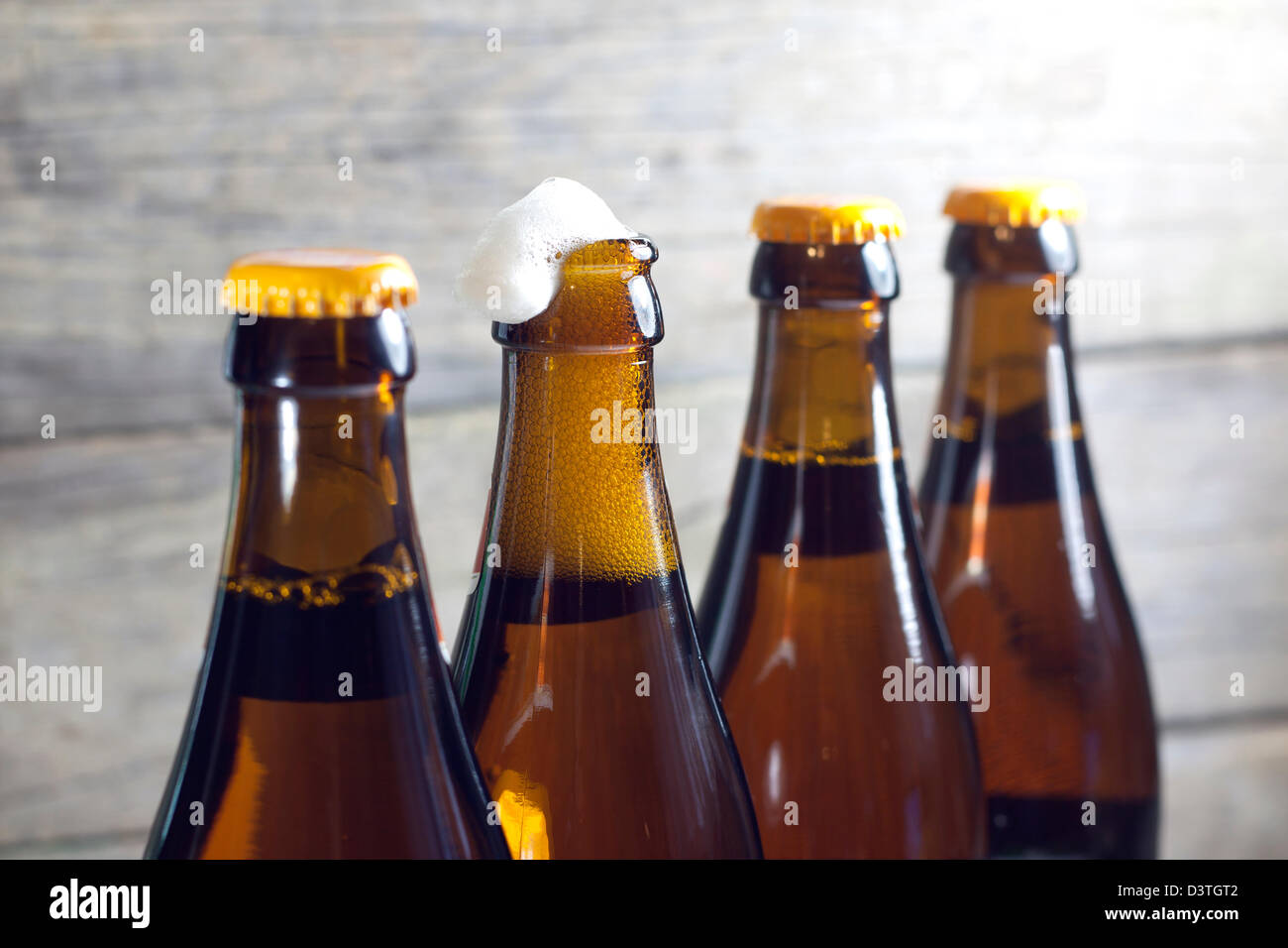 Opened bottles of beer closeup Stock Photo - Alamy