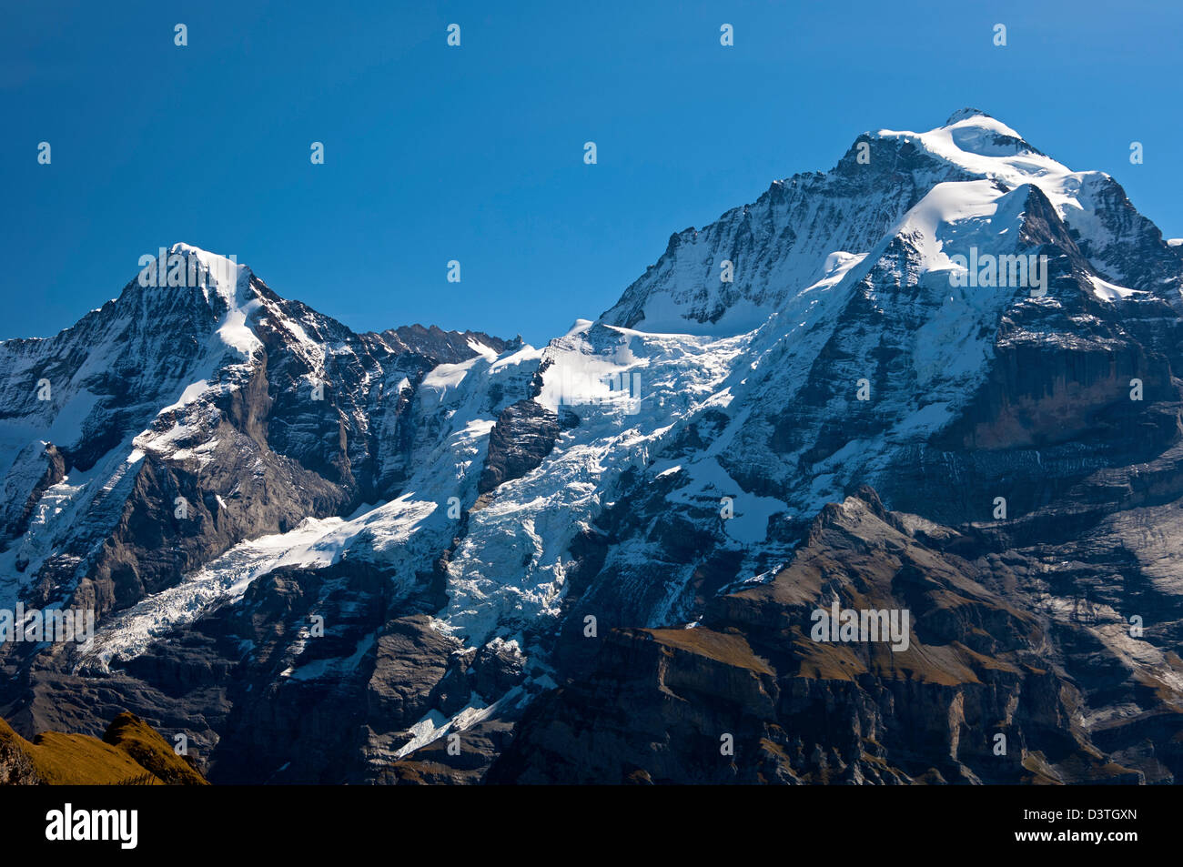 The mountain range of the Bernese Alps with the summits Moench and ...
