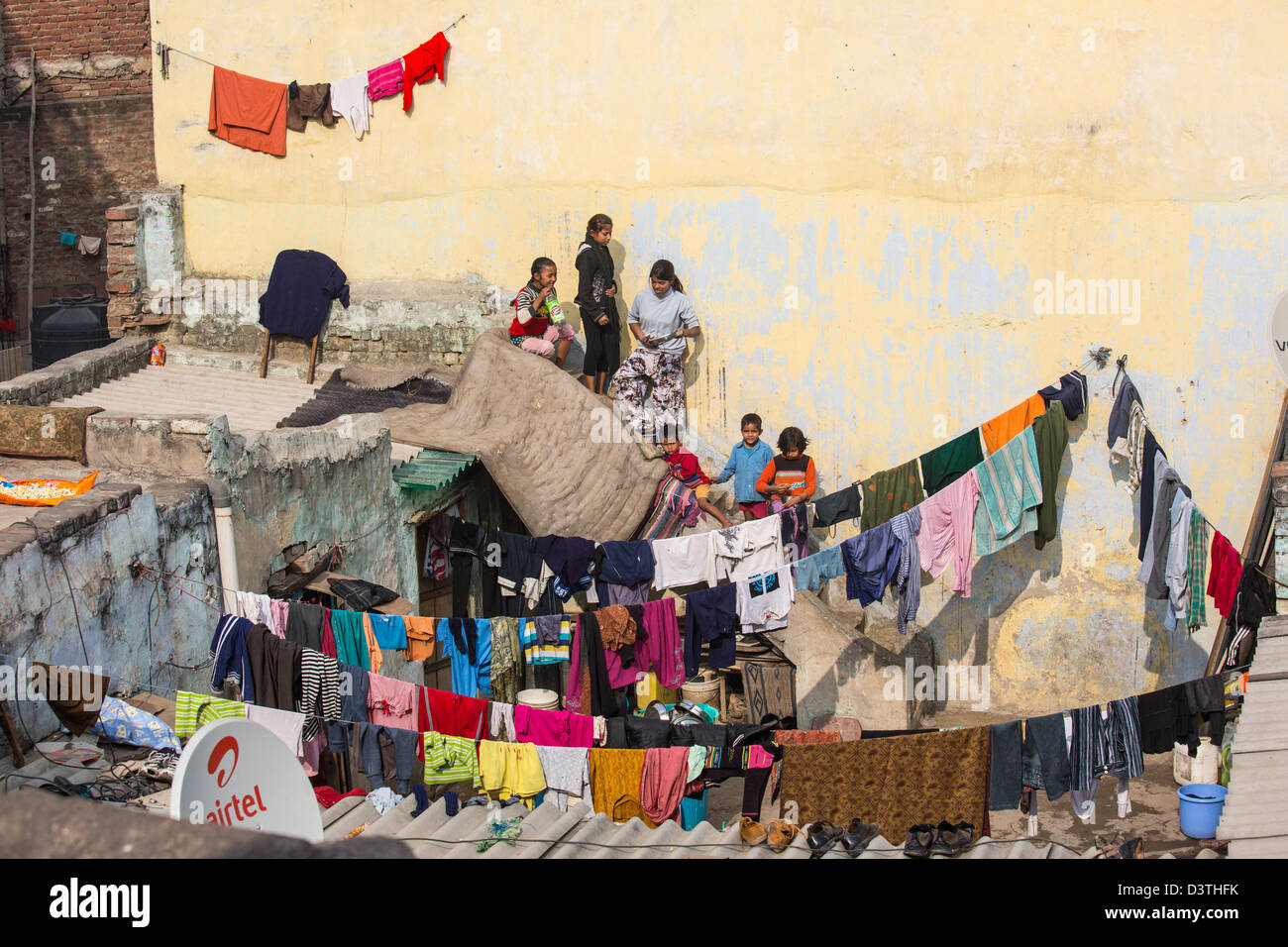 Kids and laundry, Delhi, India Stock Photo - Alamy
